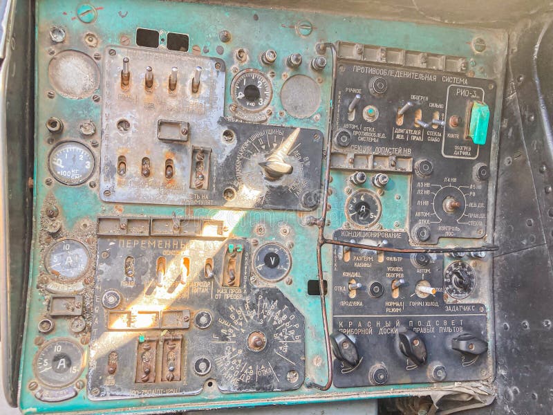 A Worn, Dirty Control Panel with Multiple Switches and Dials, Possibly ...