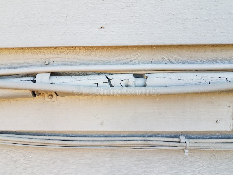 Worn Insulated Cables and Wires on Side of House or Home Stock Photo ...