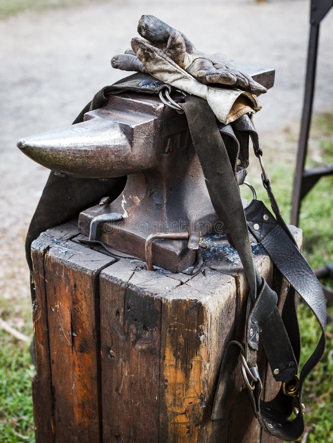 Worn Iron Anvil Apron and Gloves Stock Photo - Image of blacksmith ...