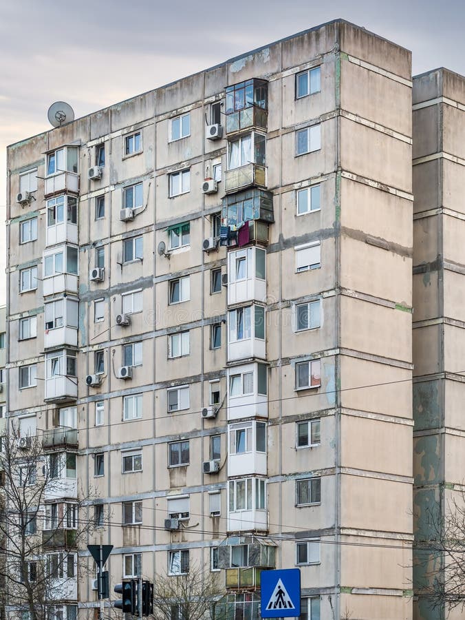 Worn Out Apartment Building from the Communist Era Against Blue Sky in ... Worn Out Apartment Building from the Communist Era Against Blue Sky in ...