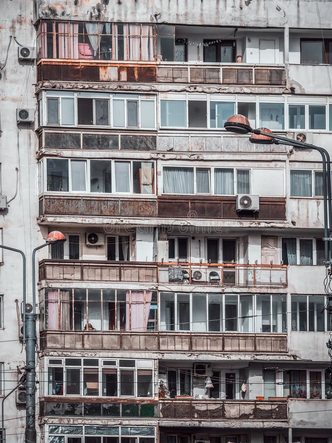 Worn Out Apartment Building from the Communist Era Against Blue Sky in ... Worn Out Apartment Building from the Communist Era Against Blue Sky in ...