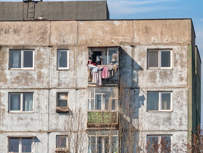Worn Out Apartment Building from the Communist Era Against Blue Sky in ... Worn Out Apartment Building from the Communist Era Against Blue Sky in ...