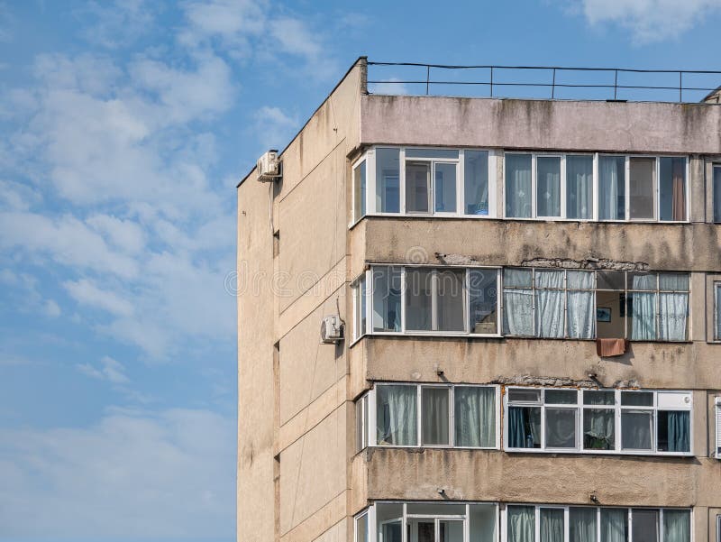 Worn Out Apartment Building from the Communist Era Against Blue Sky in ... Worn Out Apartment Building from the Communist Era Against Blue Sky in ...