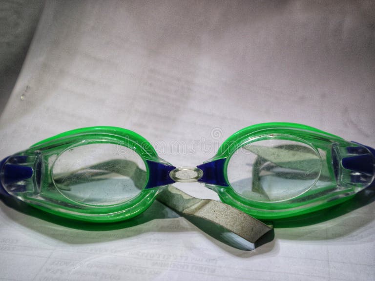 Worn-out green goggles stock image. Image of cool, green - 265895509