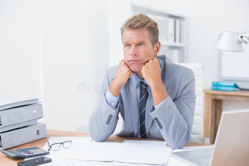 Worried Businessman Sitting at Work Stock Photo - Image of mature ...