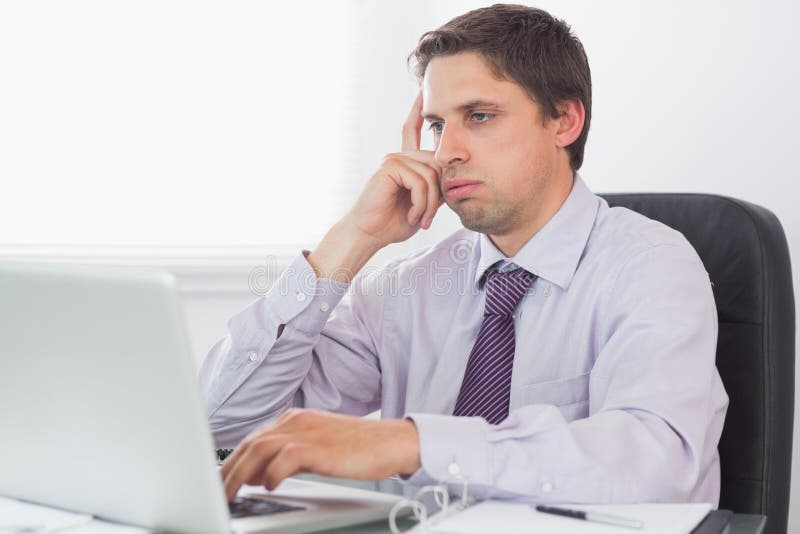 Worried Businessman Using Laptop in Office Stock Image - Image of ...