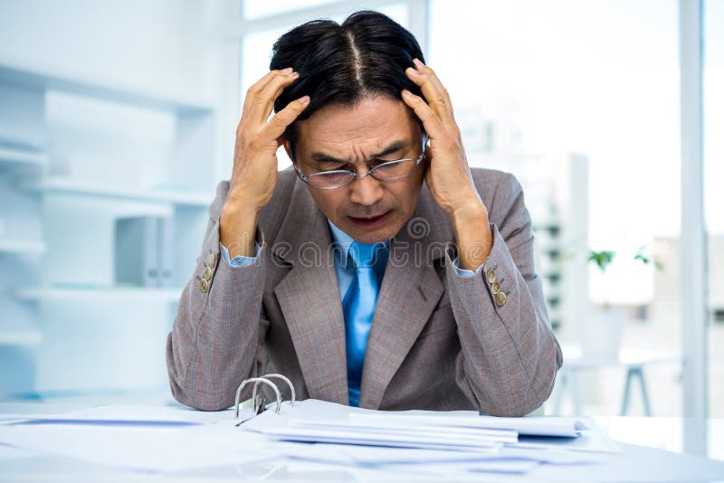 Worried Businessman Working at His Desk Stock Photo - Image of painful ...