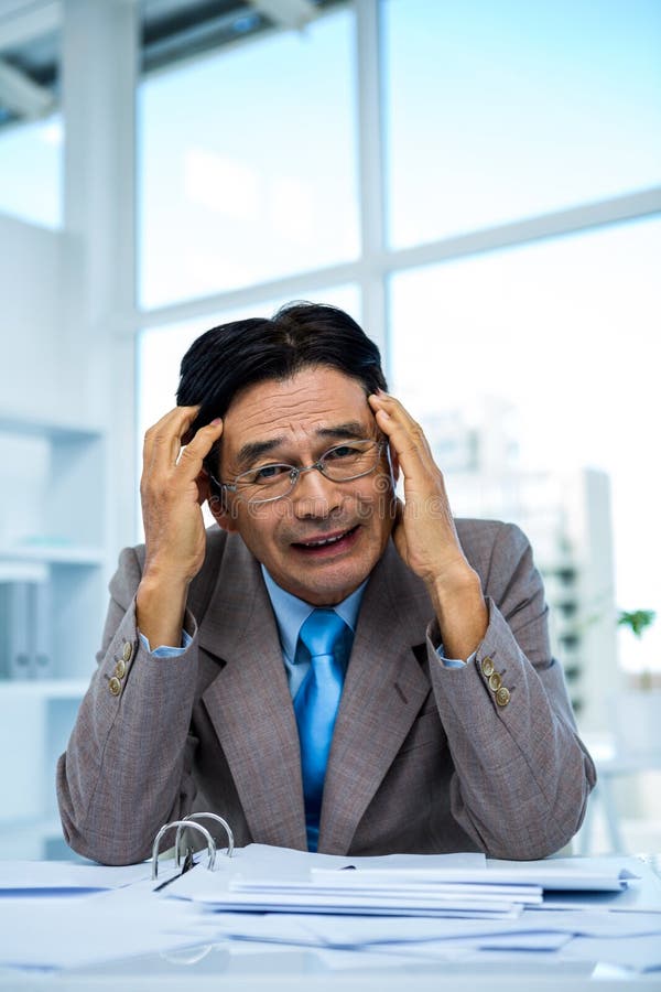 Worried Businessman Working at His Desk Stock Photo - Image of anxious ...