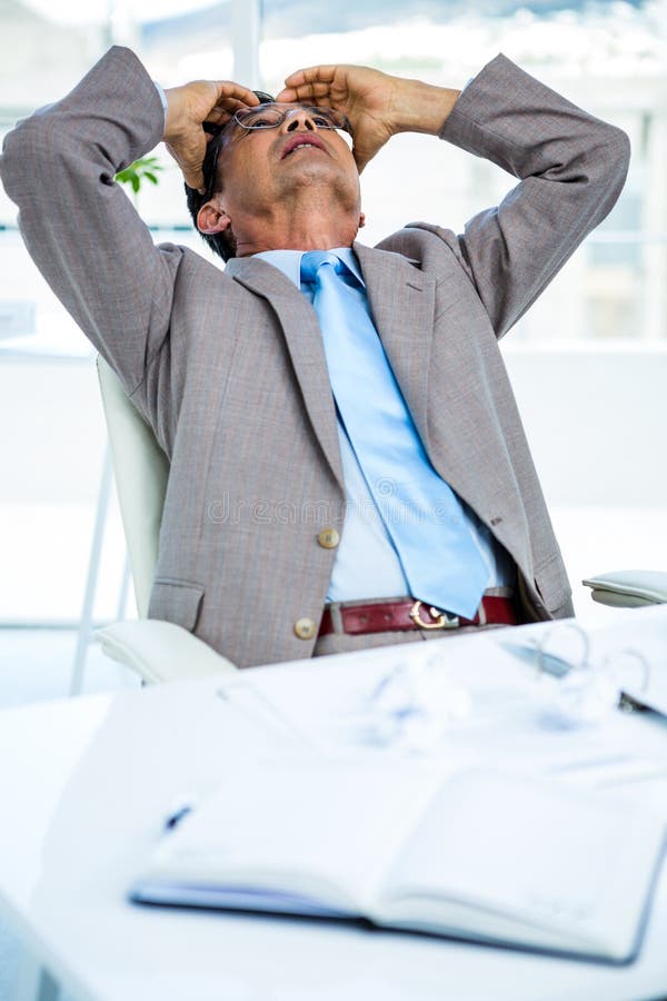 Worried Businessman Working at His Desk Stock Photo - Image of health ...