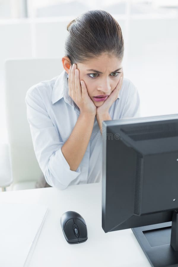 Worried Businesswoman Looking at Computer in Office Stock Image - Image ...