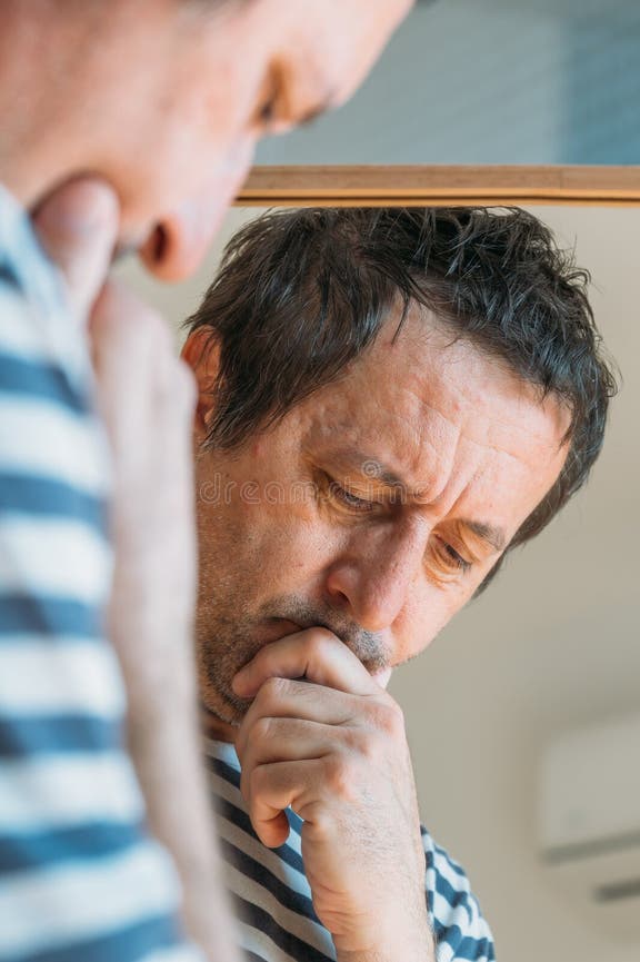 Worried Concerned Man in Front of the Mirror Stock Photo - Image of ...