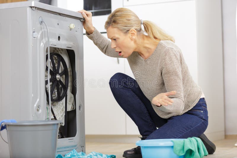 Worried Female Experiencing Problems with Washing Machine Stock Photo ...
