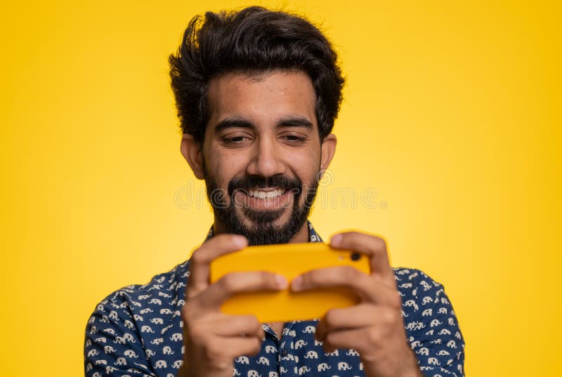 Addicted Indian Guy Playing Video Game Holding Joystick Gesturing Stock Image Image Of 9602