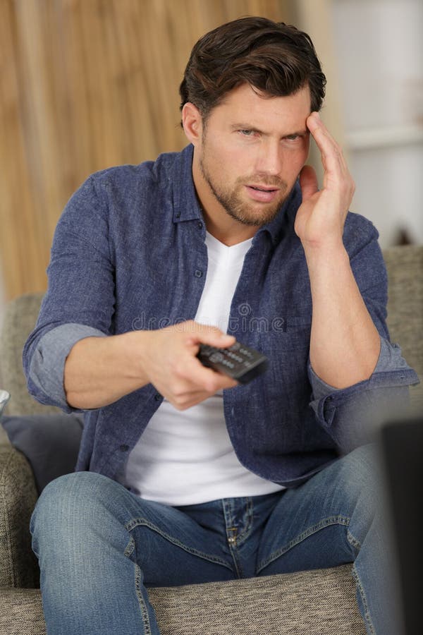 Worried Guy with Remote Control Stock Photo - Image of supporter ...
