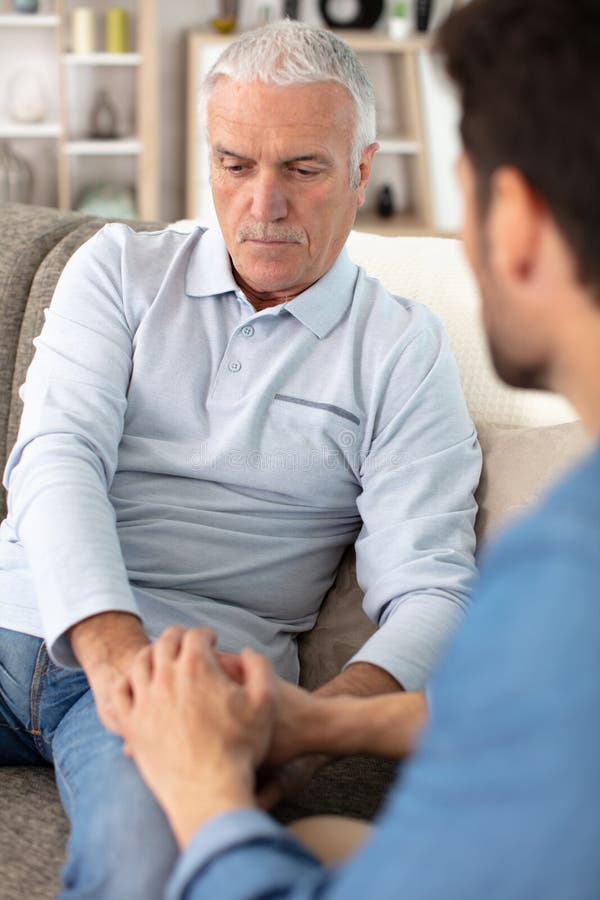 Worried Loving Son Holding Hand Father Stock Image - Image of ...