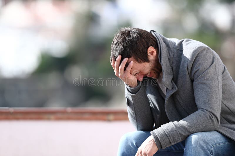 Worried Man Complaining Sitting on a Bench in Winter Stock Image ...