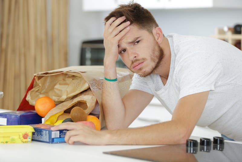 Worried Man Looking at Bills in Kitchen Stock Photo - Image of abode ...