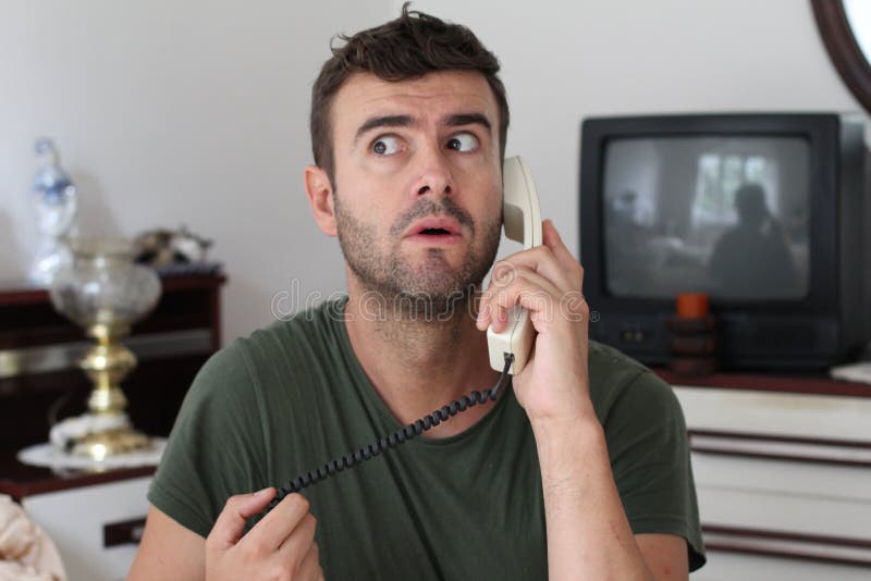 Worried man on the phone stock photo. Image of customer - 154492340