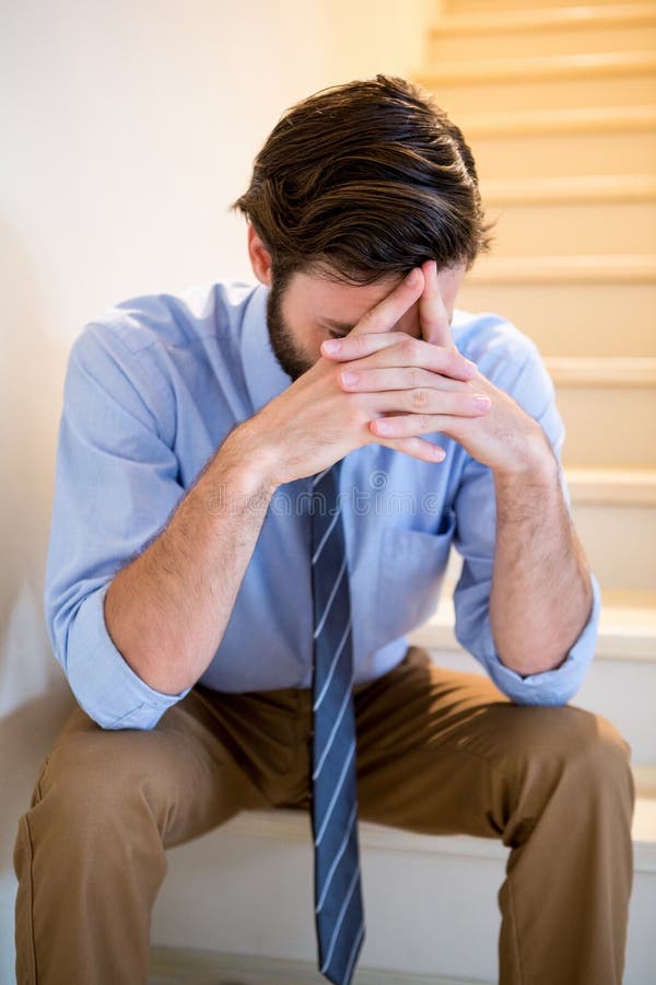 Worried Man Sitting on Stairs Stock Image - Image of abode, hands: 69795981