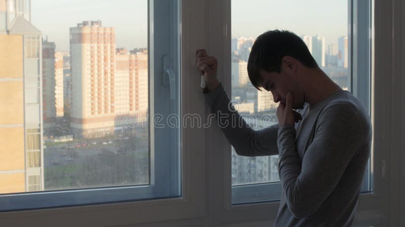Worried Man Stand and Crying Near Window Stock Footage - Video of ...