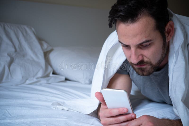 Worried Man Waiting for a Message on Cellphone Stock Image - Image of ...