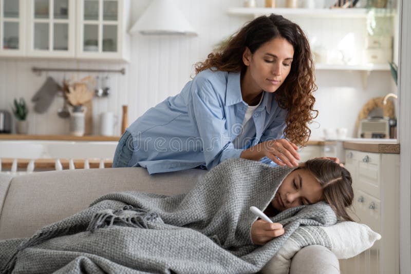 Worried Parent Mother Taking Care for Sick Child Lying in Bed Under ... Worried Parent Mother Taking Care for Sick Child Lying in Bed Under ...