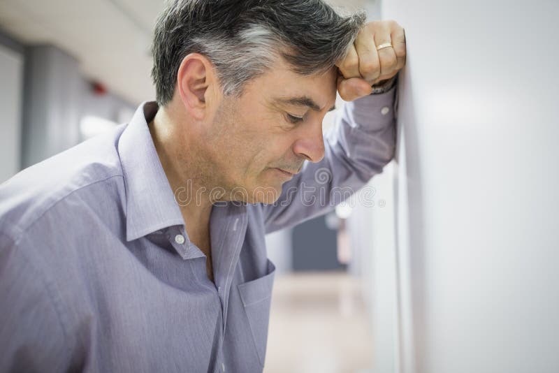 Depressed Professor Sitting with Notes and Laptop Stock Photo - Image ...