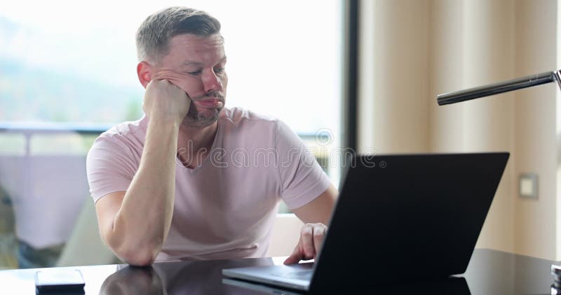 Worried Sad Man Looking at Laptop Screen Thinking about Problem ...