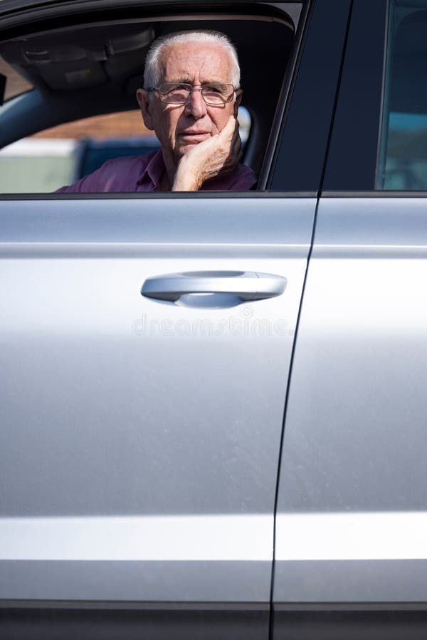 Worried Senior Male Driver Looking Out of Car Window Stock Photo ...