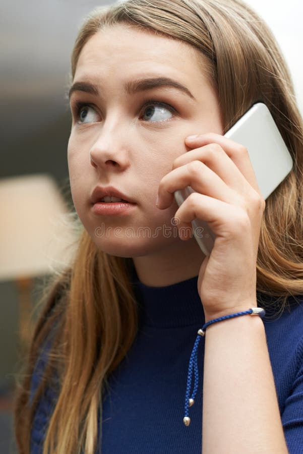 Worried Teenage Girl Making Call on Mobile Phone Stock Image - Image of ...