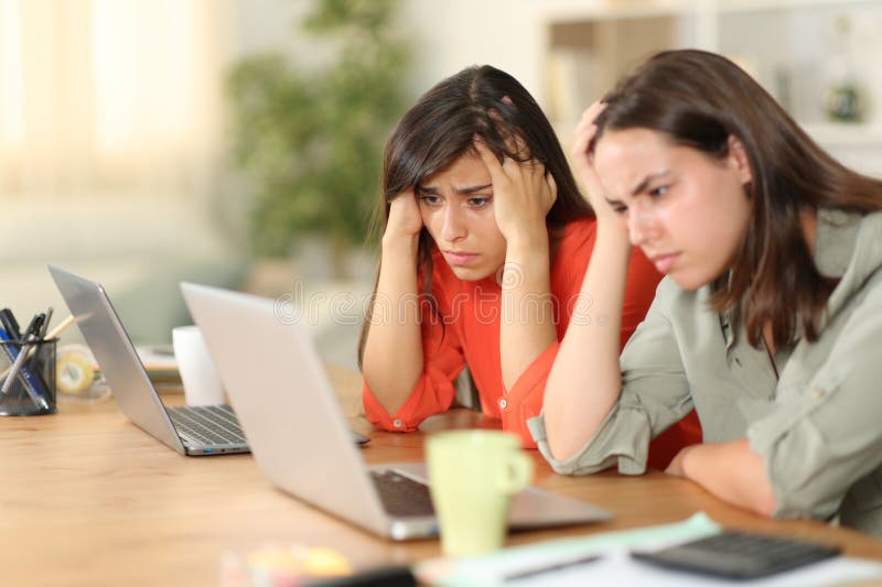 Worried Tele Workers Checking Bad News on Computer Stock Image - Image ...