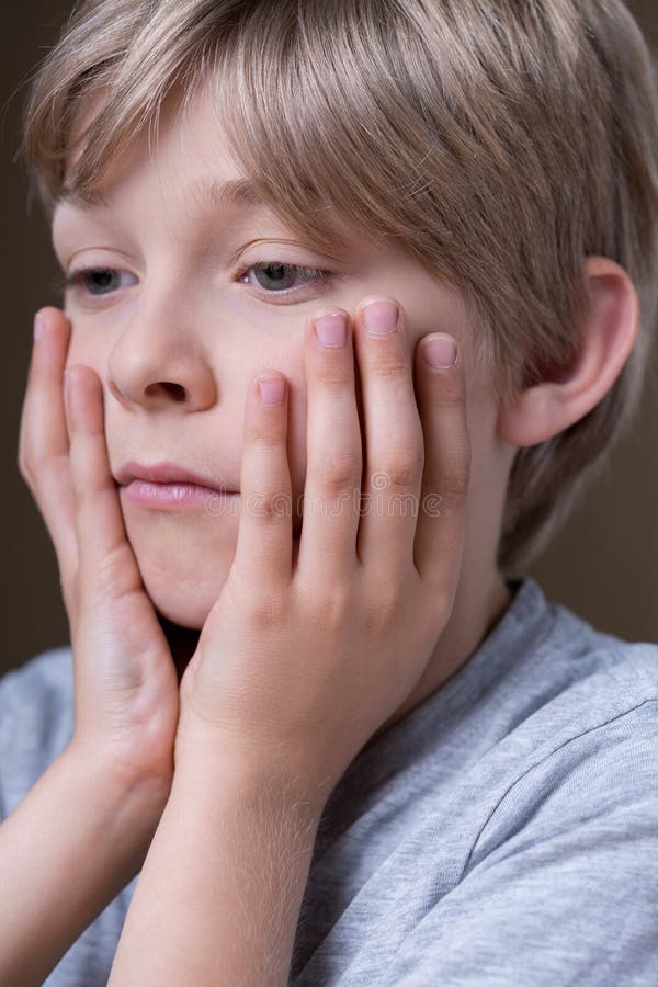 Worried young boy stock photo. Image of emotional, concerned - 68327324