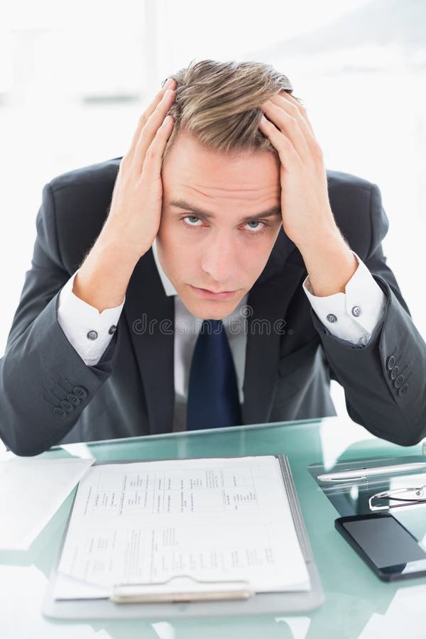 Worried Young Businessman at Office Desk Stock Photo - Image of 2529 ... Worried Young Businessman at Office Desk Stock Photo - Image of 2529 ...