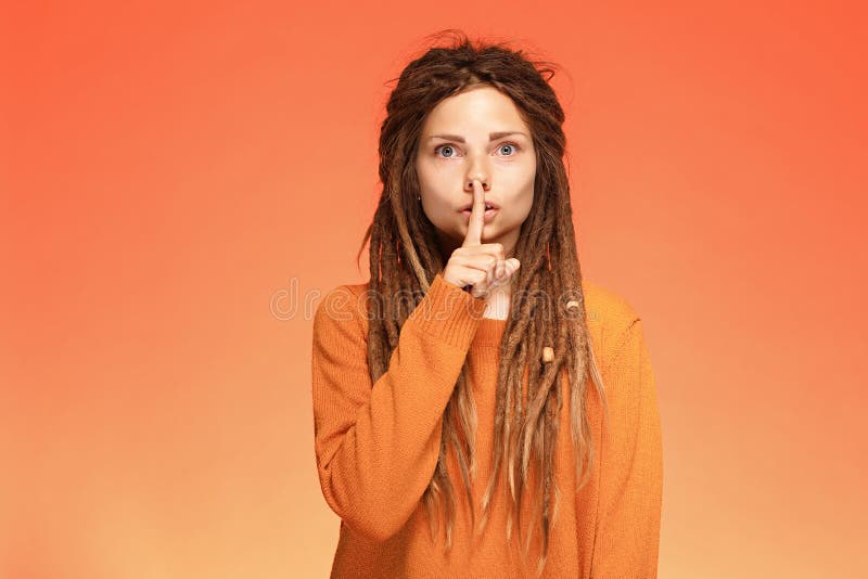 Worried Young Woman with a Shush Gesture Stock Image - Image of ...