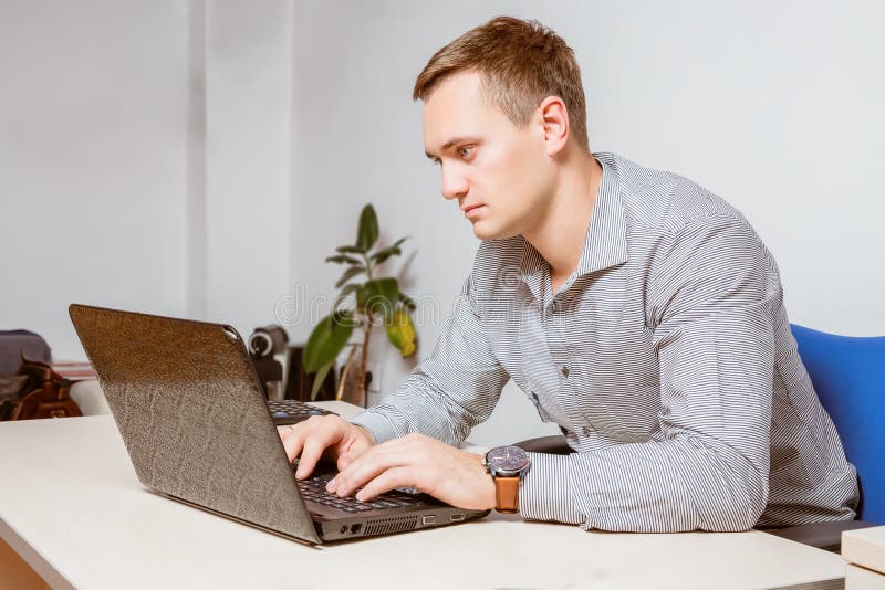 Worry Businessman Using Laptop while Sitting in Office. Worker Typing ...