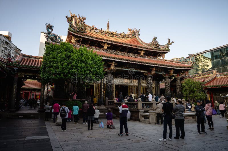 Worshipers at Longshan Temple Editorial Stock Image - Image of buddhist ... Worshipers at Longshan Temple Editorial Stock Image - Image of buddhist ...