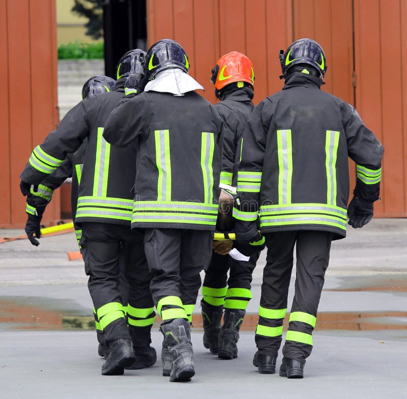 Two Firefighters Carried the Injured Away on Stretchers Stock Photo ...