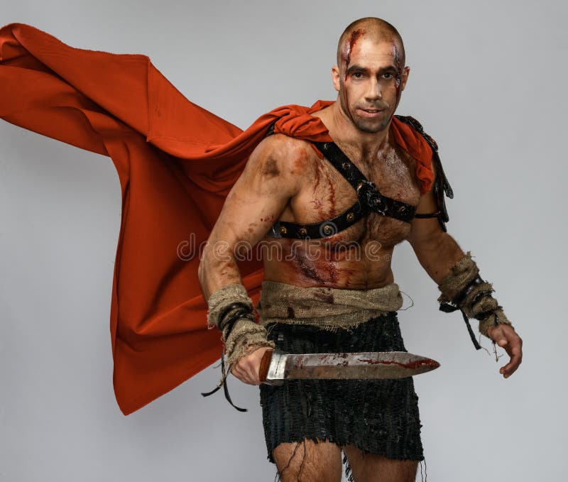 Wounded Gladiator with Sword Stock Photo - Image of empire, background ...
