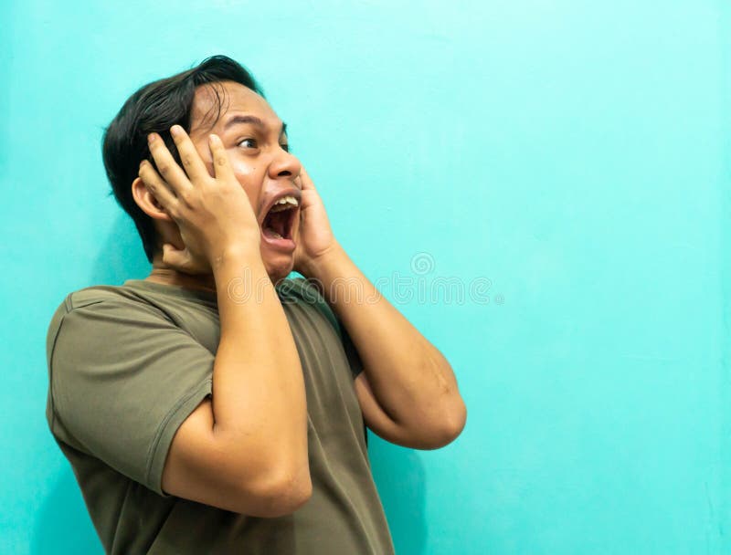 Wow and Shocked Face Expression of Young Asian Malay Man with Both Ears ...