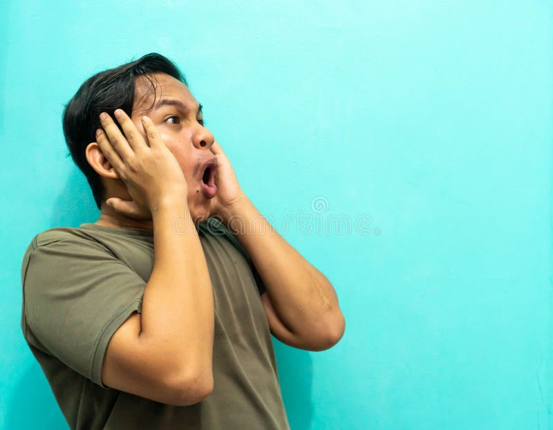 Wow And Shocked Face Expression Of Young Asian Malay Man With Both Ears
