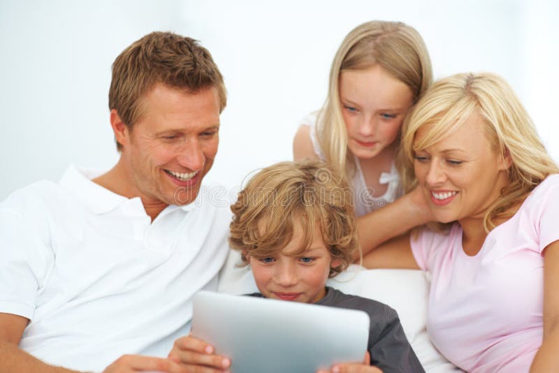 Wow this Tablet is Great. Happy Young Family Using a Digital Tablet ...
