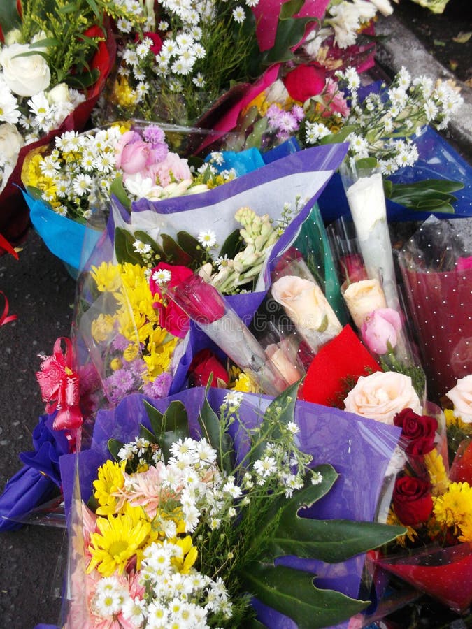 Wrapped Bouquets of Flowers Stock Photo - Image of leaves, bunch: 79771682