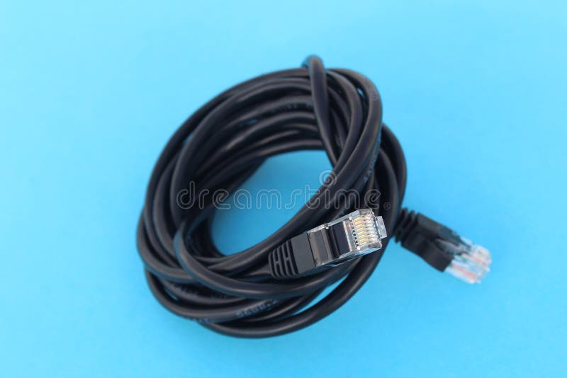 A Wrapped Cable Lies on a Blue Background. Stock Photo - Image of ...