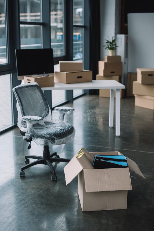 Wrapped Chair and Cardboard Boxes in Office Stock Image - Image of ...