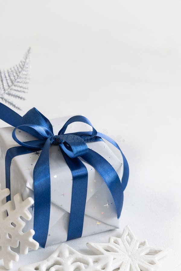 Wrapped Christmas Present with a Blue Ribbon Bow Close Up Stock Image ...
