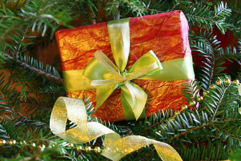 Wrapped Christmas Present Near the Christmas Tree Stock Photo - Image ...