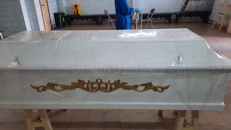 Wrapped Coffin of a Covid Patient Stock Photo - Image of metal ...