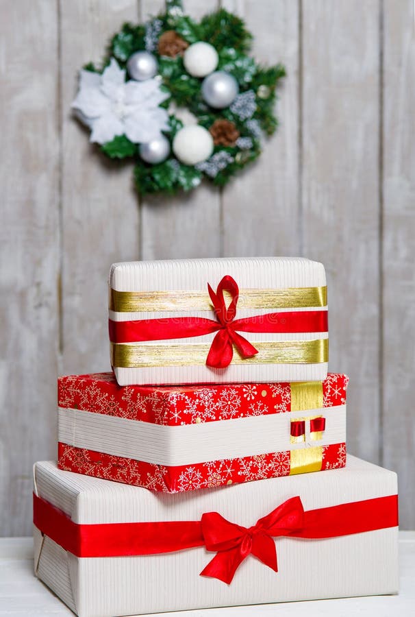 Wrapped Gift Boxes and Christmas Wreath Stock Image - Image of mood ...