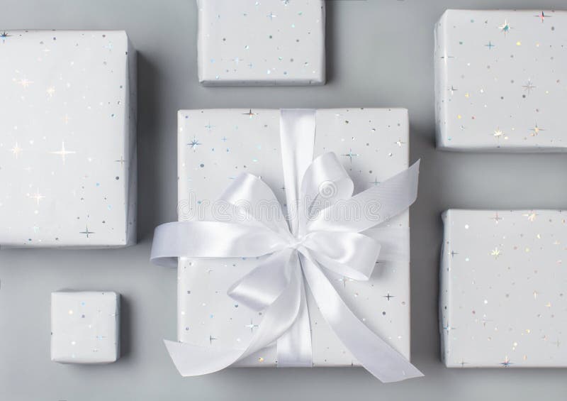 Grey Gift Box with Ribbon on Green Grass with Sun Light in the Morning ...