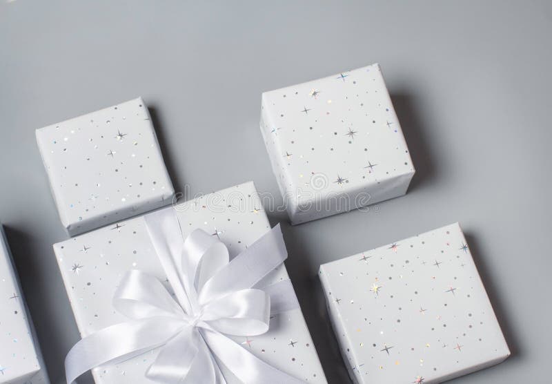 Grey Gift Box with Ribbon on Green Grass with Sun Light in the Morning ...